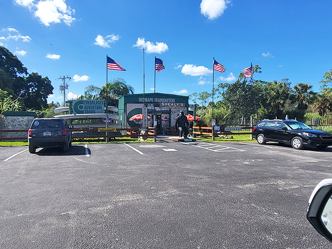 Adventure awaits beyond the parking lot! American flags flutter above this unassuming headquarters of cryptozoological curiosity in the heart of the Everglades.