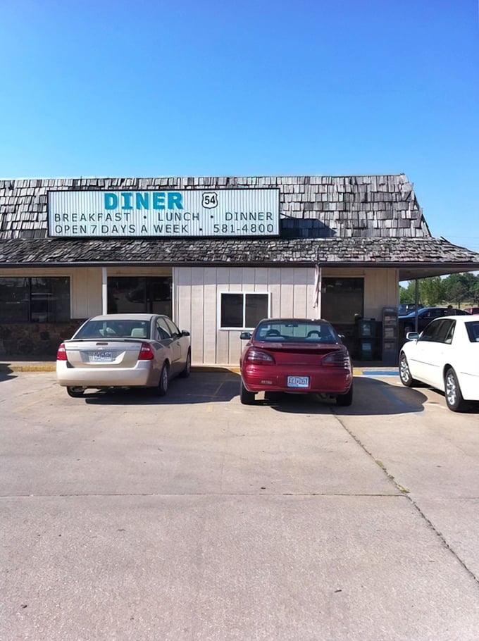 Morning light hits the Diner 54 sign just right, creating that perfect "pull over now" moment for hungry road-trippers seeking breakfast salvation.