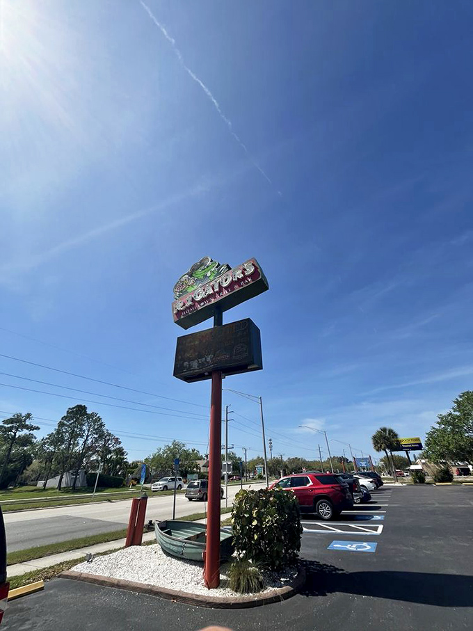 Under the brilliant Florida sky, RJ Gator's sign stands tall, guiding hungry travelers like a lighthouse for the gastronomically adrift.