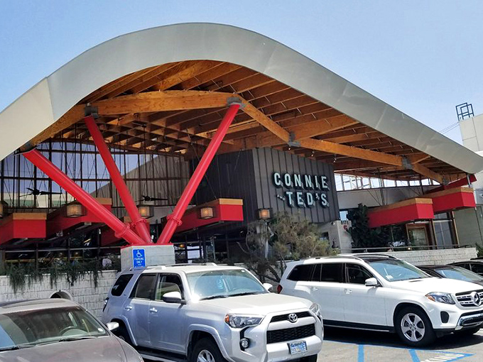 The distinctive curved roof and bold red supports make Connie and Ted's impossible to miss&mdash;architectural shorthand for "seriously good seafood happens here."