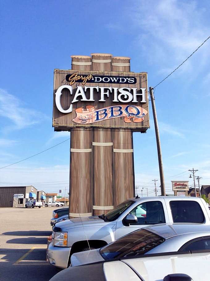 The sign stands tall like a rustic lighthouse, guiding hungry travelers to a safe harbor of Southern comfort food.
