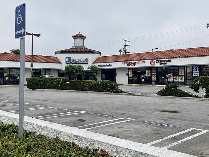 The spacious parking lot welcomes bargain hunters from across Los Angeles, with the iconic Goodwill sign promising treasures within.