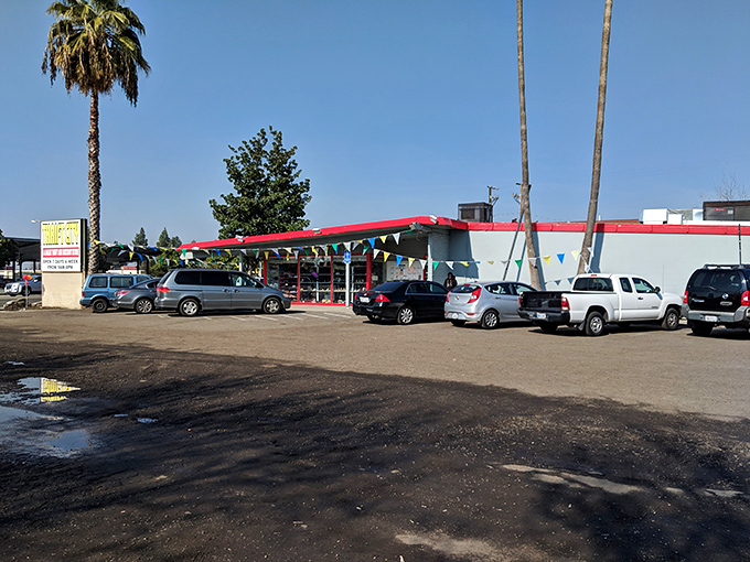 California thrifting at its finest&mdash;where palm trees stand guard over a parking lot full of cars containing soon-to-be-thrilled bargain hunters.