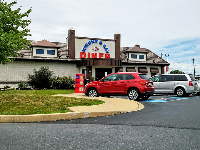 Even the parking lot says "welcome home." That red newspaper box has probably witnessed more food excitement than most food critics.