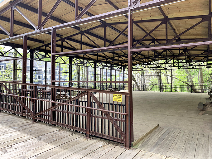 This pavilion waits patiently for family reunions where everyone pretends to remember each other's names while eyeing the potato salad.