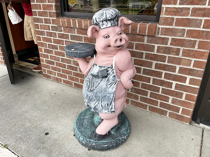 Meet the unofficial greeter&mdash;a chef pig statue who's been welcoming hungry patrons longer than most servers have been alive.