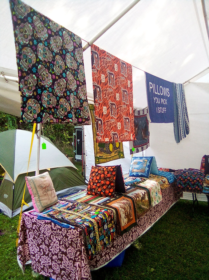 Textile paradise where pillows and fabrics transform camping chairs into thrones. The sign promising "YOU PICK I STUFF" might be the most honest retail slogan ever created.