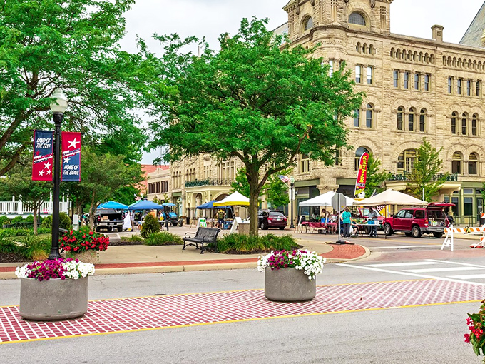 Downtown Piqua transforms into a vibrant community hub during market days. Those flower planters aren't just pretty – they're strategic sitting spots for people-watching.