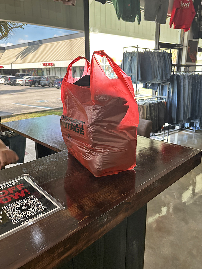 Success! That distinctive red bag means someone's found their perfect vintage piece among thousands of possibilities.