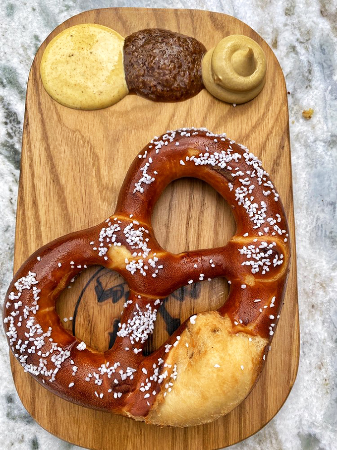 The Bavarian pretzel arrives on a wooden board with three mustard varieties&mdash;a carb-lover's dream that puts mall pretzels to absolute shame.