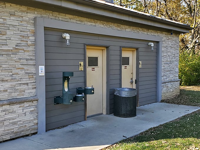 Even the restrooms maintain the park's stone aesthetic, proving that form and function can coexist in perfect municipal harmony.