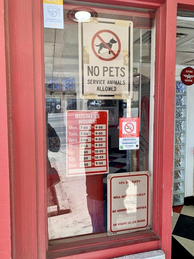 The door signs tell you the practical details, but what they really mean is "Happiness served daily from 7am until closing."