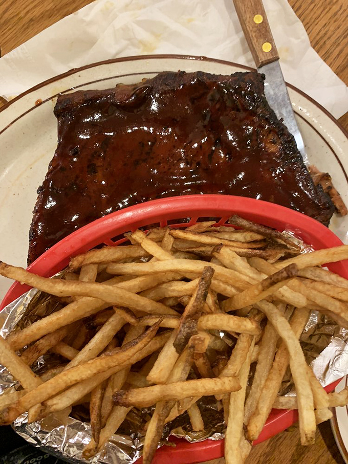Ribs that pass the "fall off the bone" test with flying colors. That glistening sauce and golden fries are the stuff of roadtrip legends.