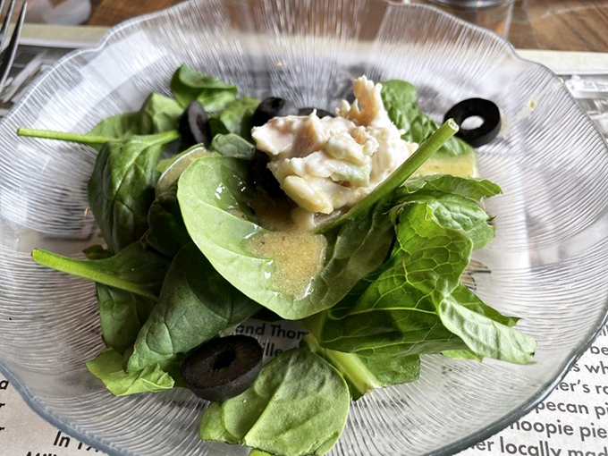 Fresh salad provides a virtuous moment before diving headfirst into the serious comfort food business.