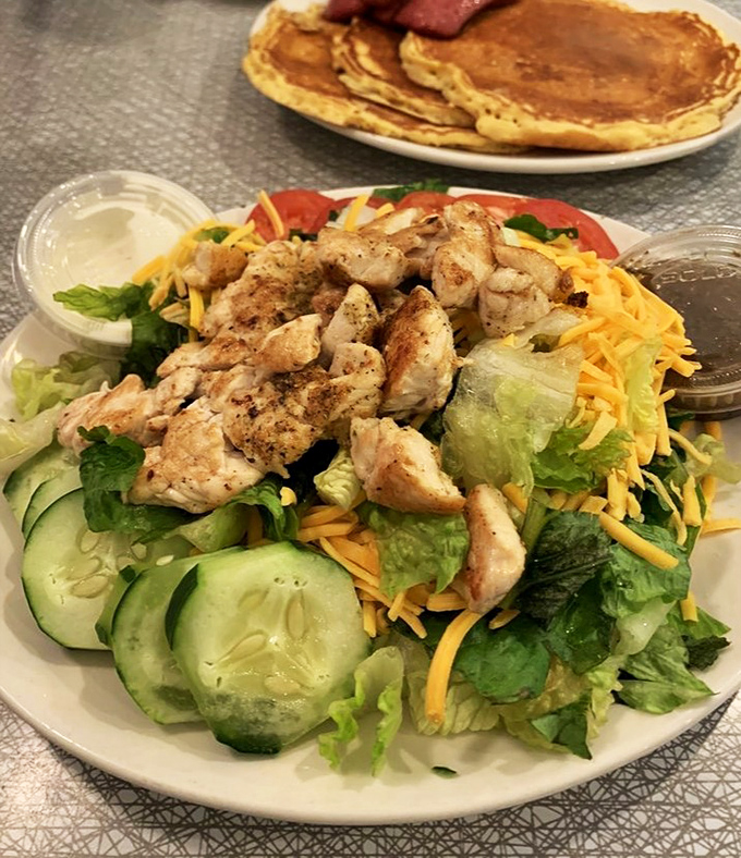 Even the salads here mean business—fresh, colorful, and substantial enough to satisfy without triggering food envy for your neighbor's burger.