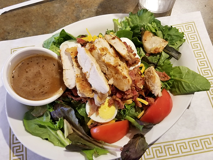 A salad that doesn't apologize for being healthy, brightened with grilled chicken, bacon bits, and hard-boiled egg for protein-packed persuasion.