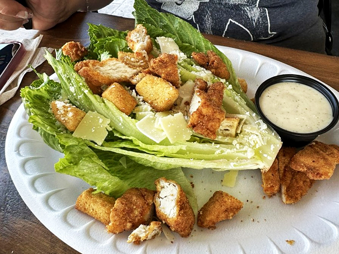 Caesar salad gets the Lake Erie treatment with golden fish nuggets. Even vegetables celebrate when they're invited to this seafood party.