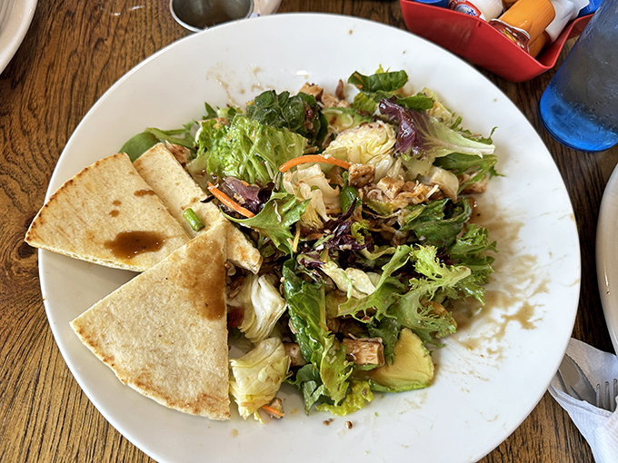 A salad that doesn't apologize for being healthy, served with pita triangles that understand their supporting role perfectly.