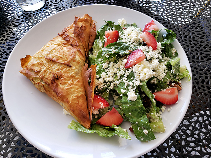 A phyllo-wrapped savory pastry alongside a strawberry-studded salad &ndash; proof that lunch at Lucy in the Rye deserves just as much attention as breakfast.