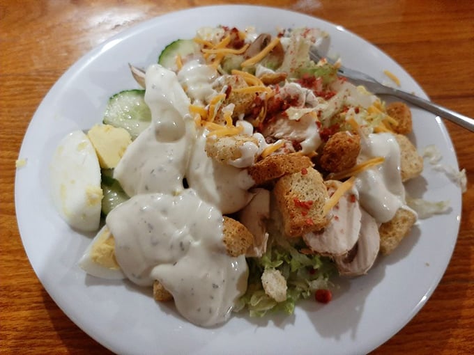 A salad that doesn't apologize for the ranch waterfall. In Missouri, vegetables are just vehicles for delivering creamy dressing and cheese.