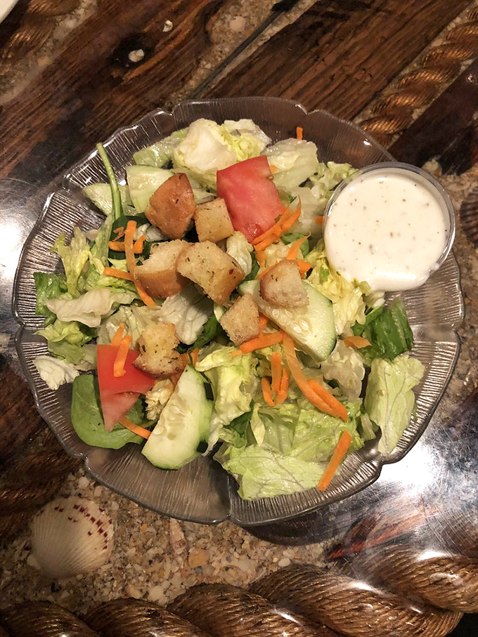 A garden of crispness in a glass bowl. This isn't just a side salad&mdash;it's the supporting actor that deserves its own award.