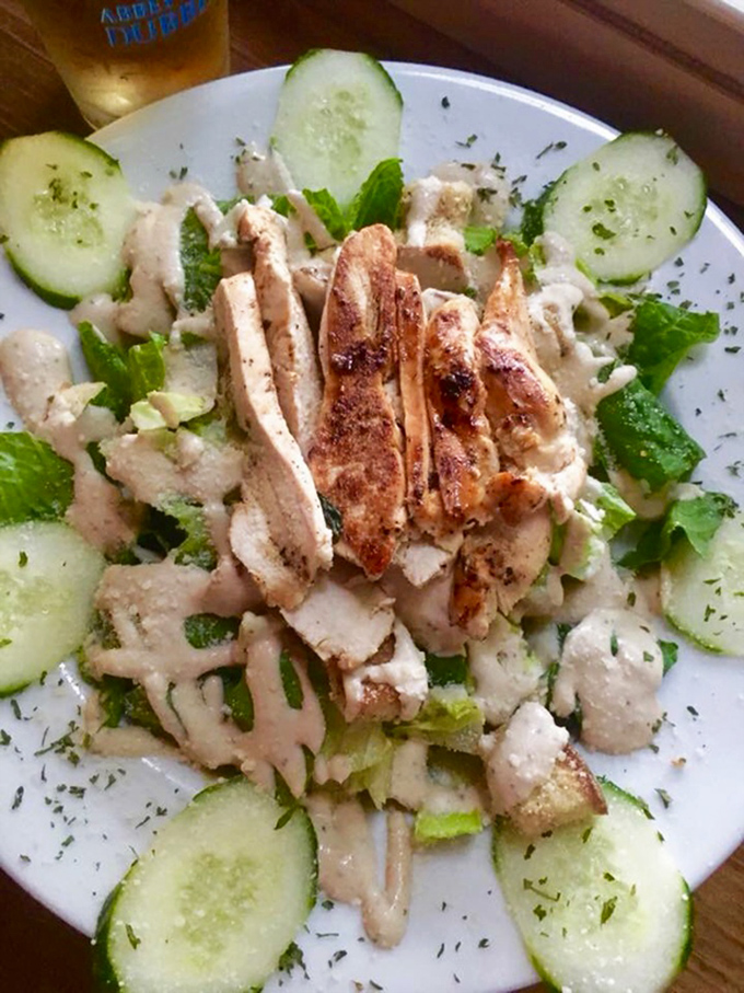 A fresh salad with grilled chicken offers a lighter option without sacrificing flavor&mdash;because balance is important, even in tavern dining.