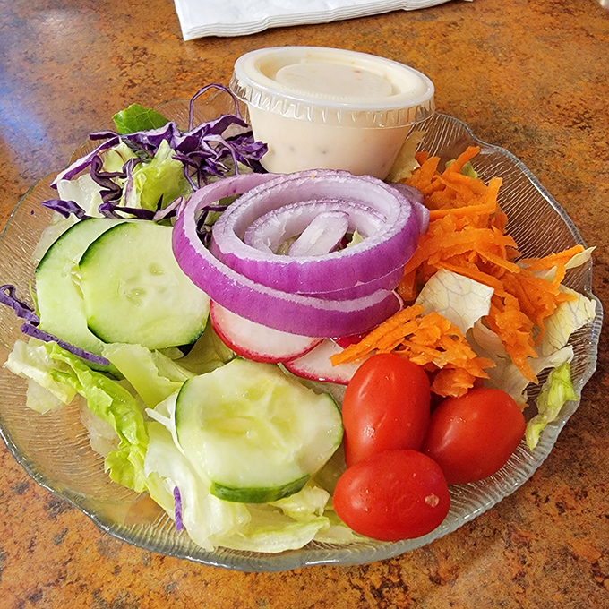 Fresh garden salad with crisp vegetables proves that diners can deliver healthy options alongside their comfort classics.