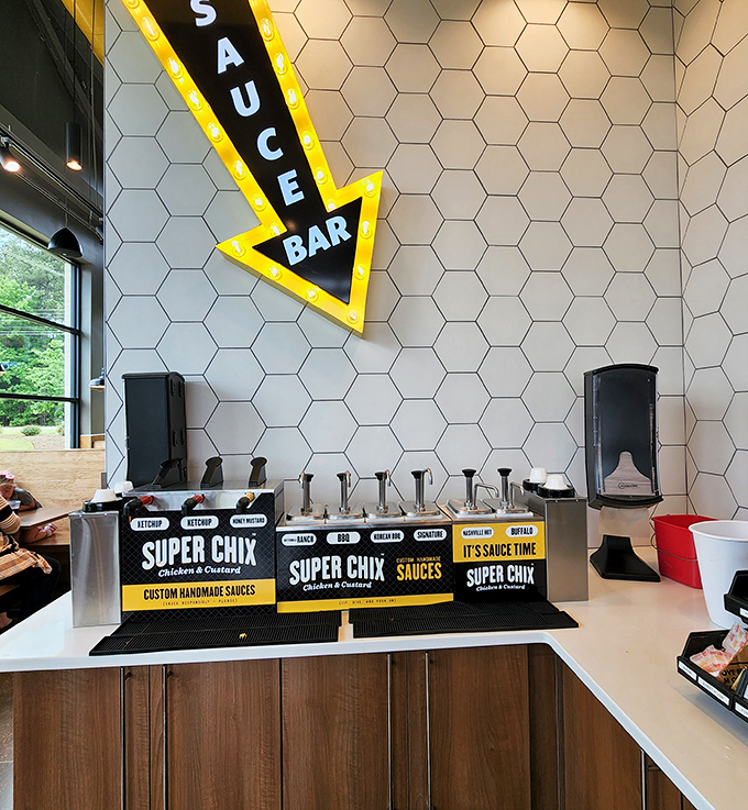 The sauce bar&mdash;where chicken destinies are decided. That illuminated arrow might be the most honest sign in fast food: yes, sauce IS the way.