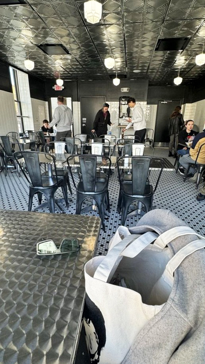 Modern industrial seating meets classic tin ceilings &ndash; a space designed for one purpose only: focused appreciation of legendary sandwiches.