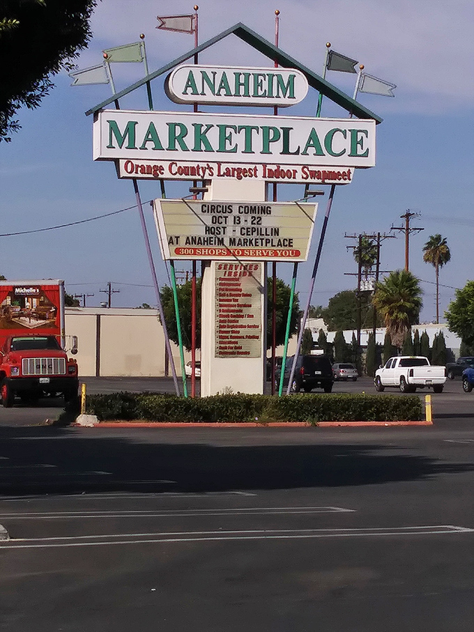 The retro sign proudly announces "Orange County's Largest Indoor Swapmeet." This landmark has guided treasure hunters to their destination for generations.
