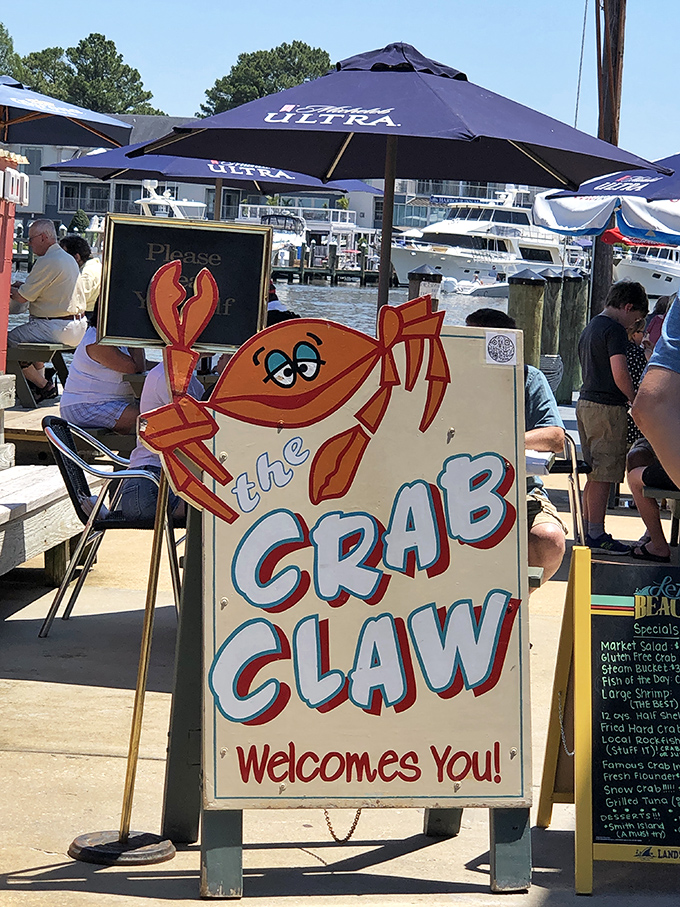"The Crab Claw welcomes you!" promises the cheerful sign, its cartoon mascot waving a claw as if to say, "What took you so long?"