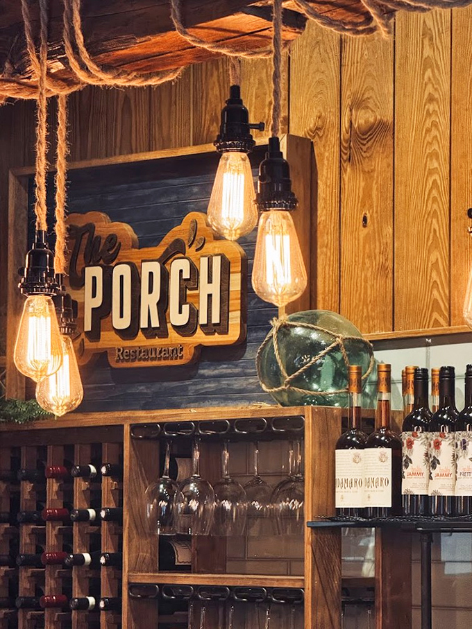 Edison bulbs hanging from rope illuminate The Porch's sign, creating the kind of ambiance that makes every photo Instagram-worthy.