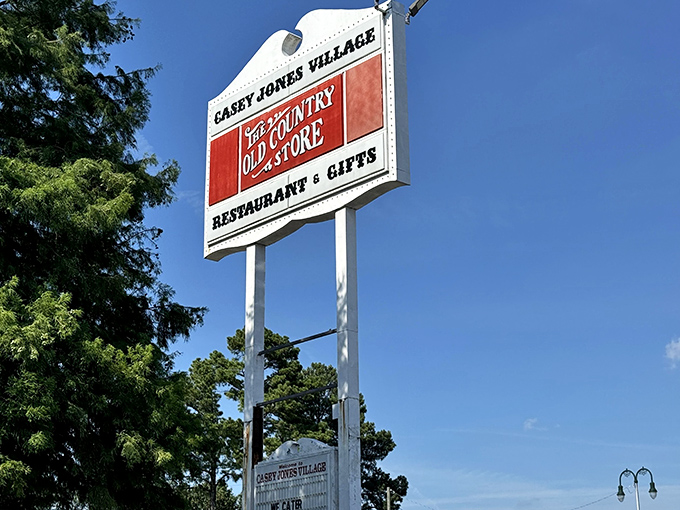 The Casey Jones Village sign stands tall against the Tennessee sky, guiding hungry travelers to their Southern food salvation.