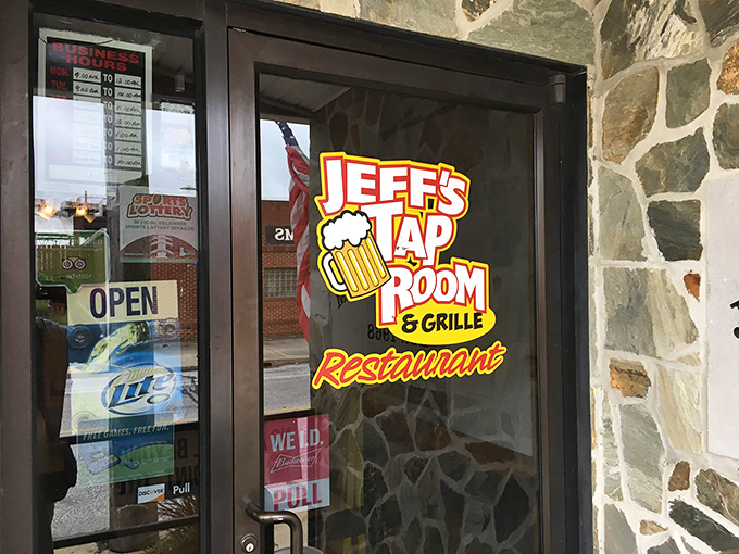 The door to happiness has a beer logo on it. Jeff's Taproom & Grille promises good times before you even cross the threshold.