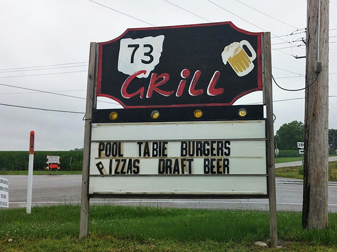 This roadside sign has been luring hungry travelers with promises of pool tables, burgers, and cold beer.