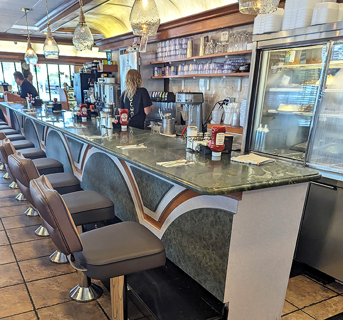 Where diner magic happens &ndash; the counter service area where coffee is always fresh and the staff knows regulars by their breakfast preferences.