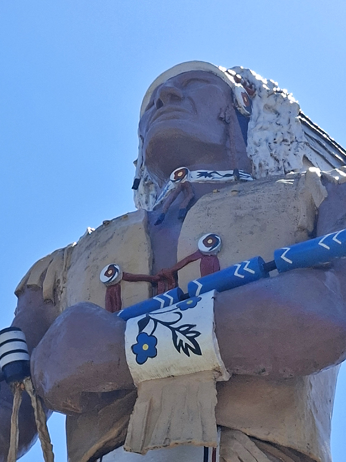 Detail work that demands a double-take: The intricate designs on Hiawatha's ceremonial pipe and wristbands required scaffolding just to paint.