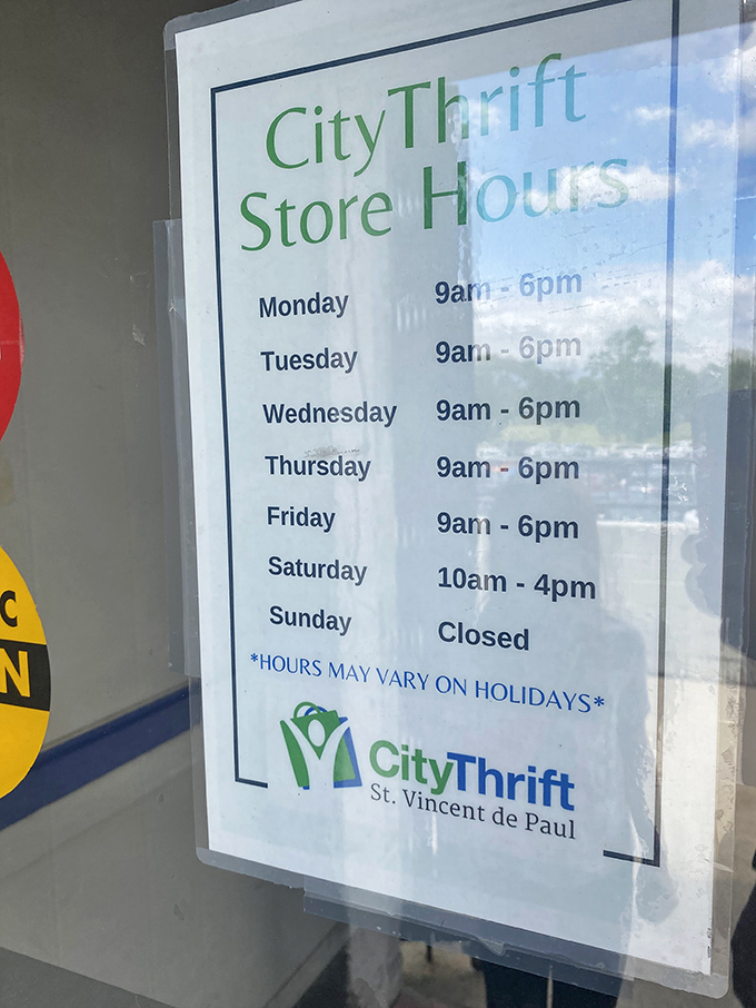 The sacred schedule of savings. These posted hours are like treasure maps, guiding the thrifty to their next great find six days a week.