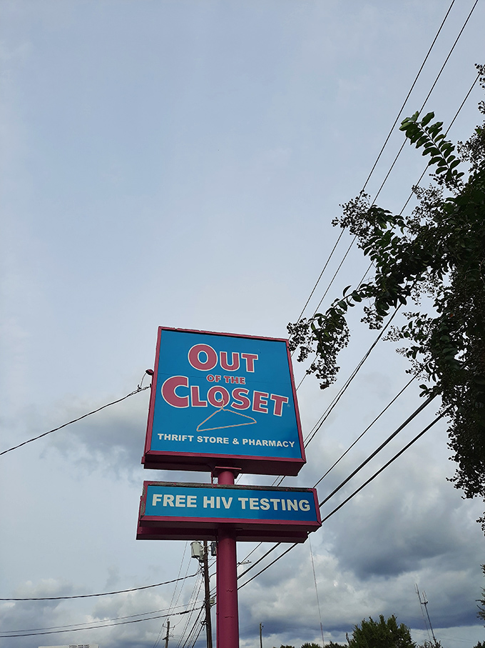 The roadside sign serves as both landmark and mission statement, announcing free HIV testing alongside thrifting opportunities.