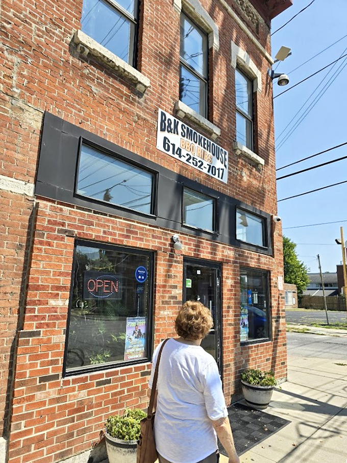 Pilgrims approach the temple of smoke. That "OPEN" sign might be the most beautiful word in the English language when you're craving brisket.