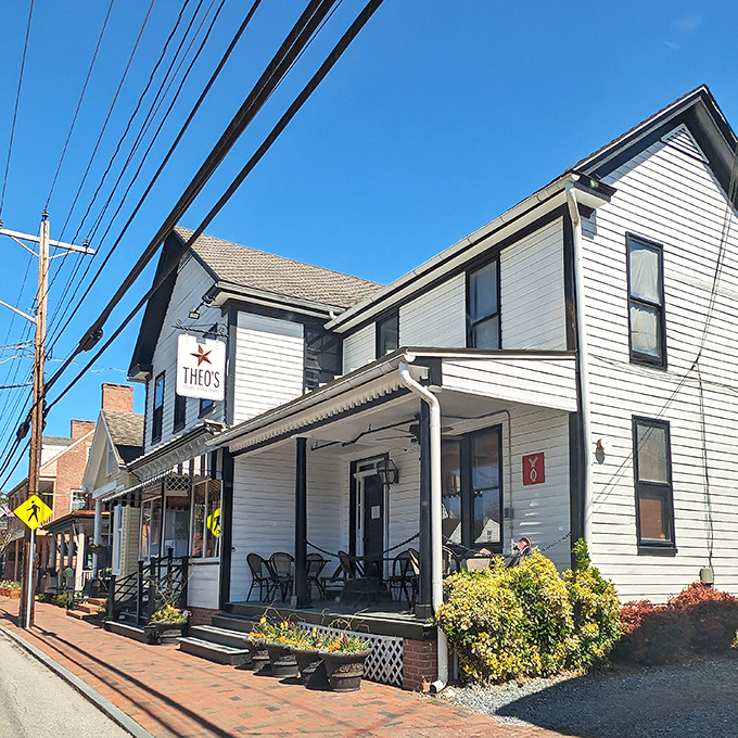 Sunshine bathes the historic fa&ccedil;ade while yellow flowers add a cheerful welcome. Small-town charm with big-city culinary credentials.