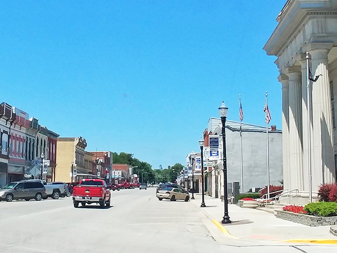 Main Street stretches toward the horizon like an invitation to explore, its lampposts standing at attention and historic buildings lining the way like old friends.