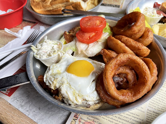 A burger topped with a sunny-side egg and flanked by onion rings the size of bracelets. Napkins required, diet resolutions suspended.