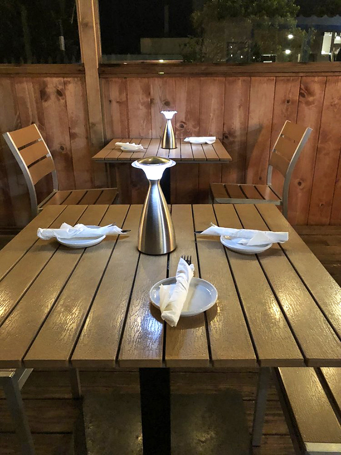 Outdoor tables await their moment in the spotlight, ready to host memorable meals under the Pacific Grove sky.