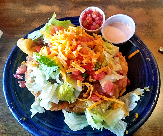 Fresh, colorful, and piled high with goodness &ndash; this isn't just lunch, it's edible artwork on blue ceramics.