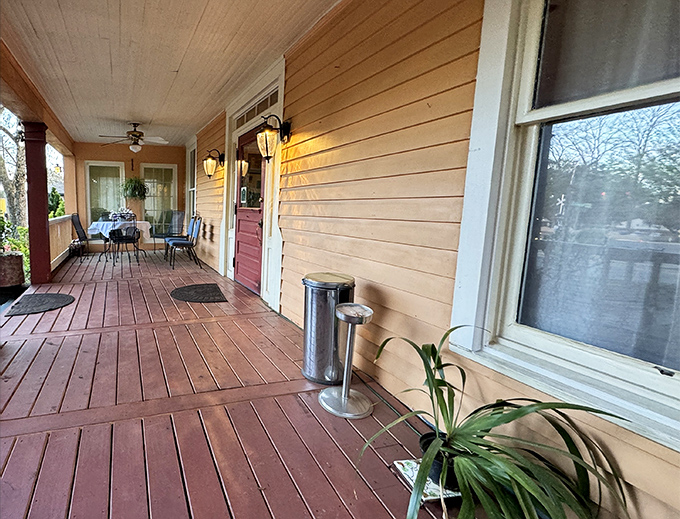 A wraparound porch that whispers of Southern hospitality while promising Italian culinary adventures waiting just inside.