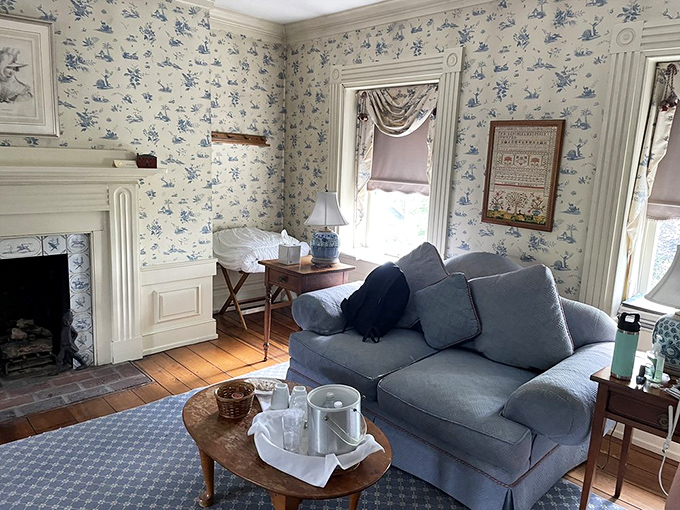 The Washington Room's blue and white wallpaper creates a colonial elegance that would make Martha Washington feel right at home. That fireplace has probably heard some fascinating political debates.