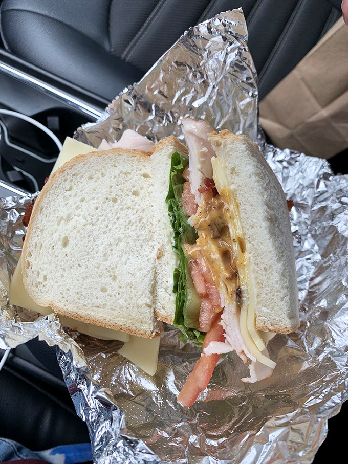 The turkey club in its natural habitat&mdash;your car. Some sandwiches are so good they don't even make it home. This is clearly one of them.