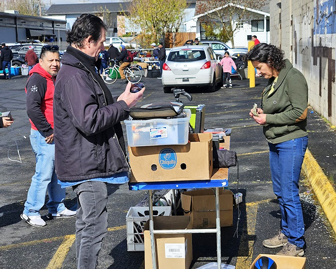The art of the deal in progress. Modern technology meets old-school haggling as this vendor negotiates with smartphone in hand.