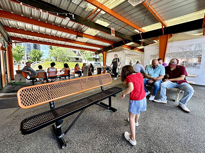 The outdoor waiting area isn't just a place to kill time&mdash;it's where anticipation builds and the aroma of burgers makes patience nearly impossible.
